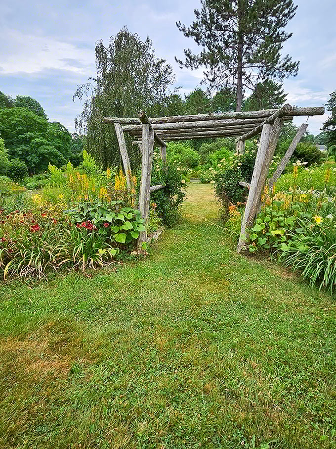 This rustic wooden arbor isn't just an entrance &ndash; it's nature's way of saying "you're about to see something spectacular" without using a single word.