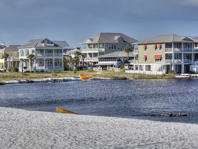 Where fresh water meets salt in perfect harmony. These colorful beach homes overlook Western Lake, one of Florida's rare coastal dune lakes.