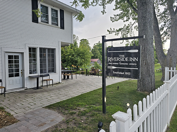 The Riverside Inn stands as a testament to timeless elegance, its white clapboard exterior promising culinary delights within its historic walls.