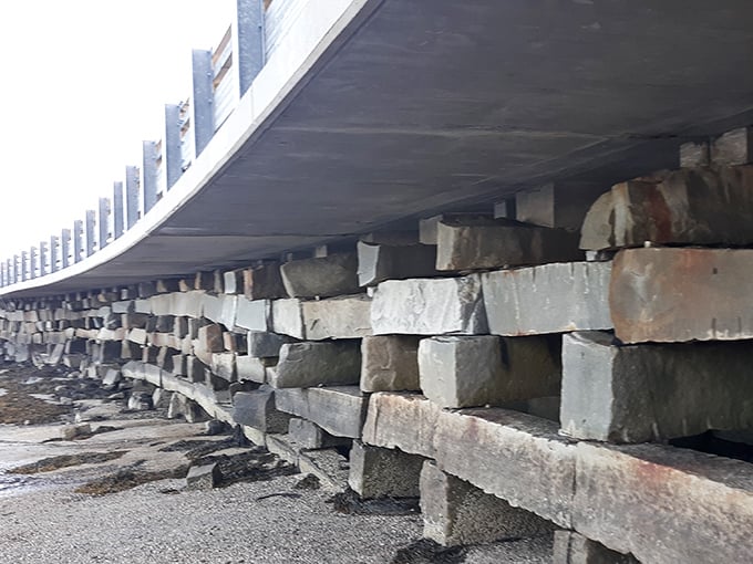 Close-up of the ingenious granite cribwork construction, showing how stones are stacked without mortar yet remain sturdy.