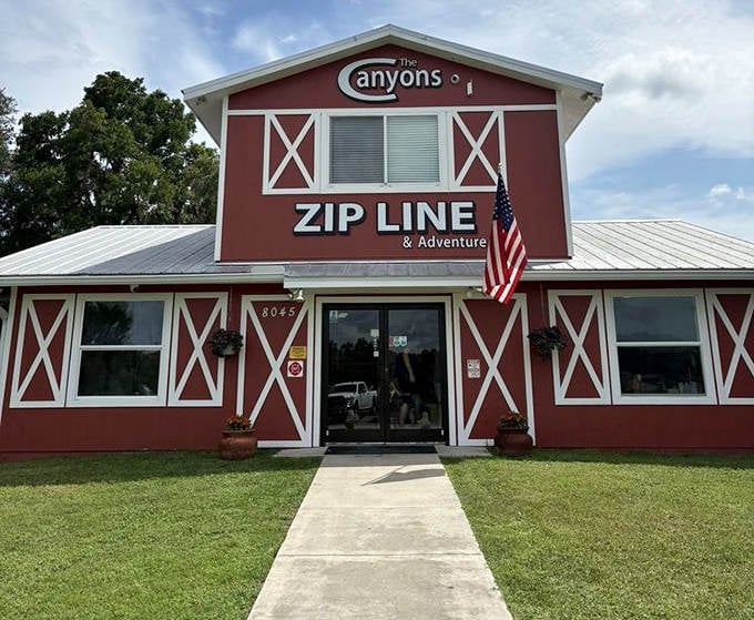 The charming red barn welcome center belies the heart-pounding adventures that await beyond its doors at The Canyons.