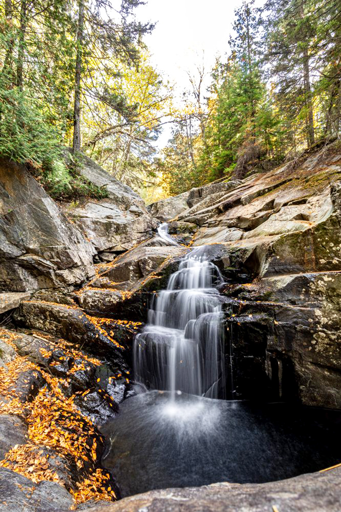 This isn't just falling water &ndash; it's Maine's liquid poetry cascading over ancient stone, creating pools clear enough to count pebbles.