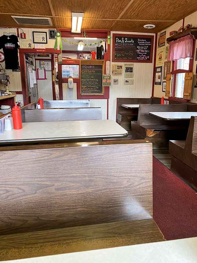 Wooden booths, ceiling fans, and chalkboards create the perfect no-frills atmosphere for serious burger consumption.