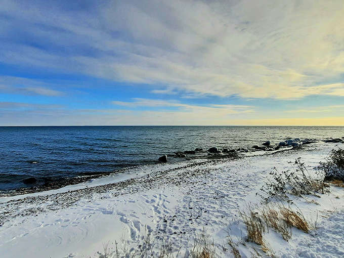 The vast expanse of Lake Superior stretches to the horizon like an inland ocean, its moods changing with the sky above.