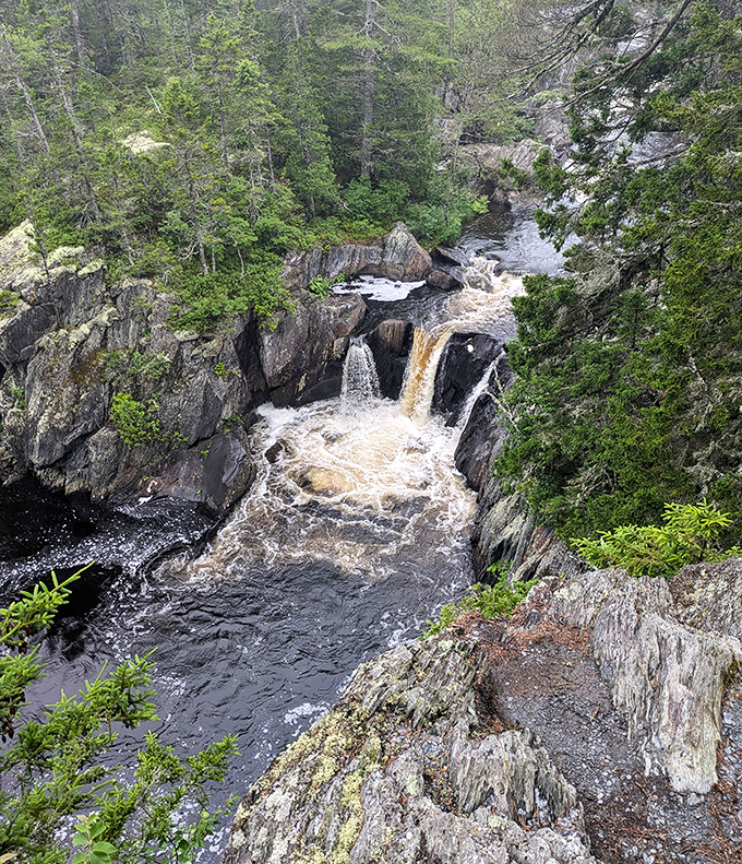 Nature's masterpiece revealed from above &ndash; these cascading waterfalls have been sculpting the slate gorge for millennia.