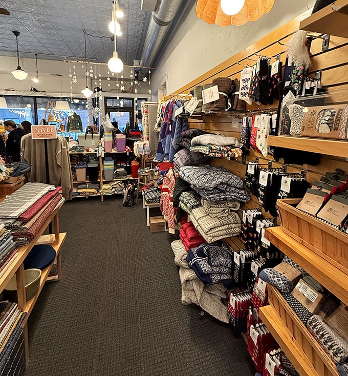 Cozy knits and traditional textiles line the walls, each piece telling a story of craftsmanship that spans generations.