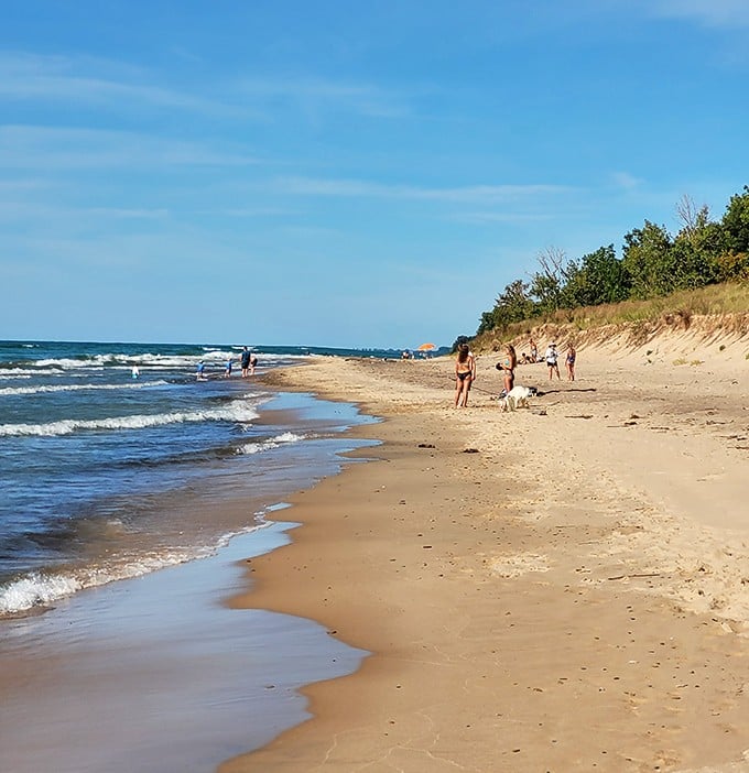 Beachgoers enjoy the perfect balance of solitude and sociability along Grand Mere's expansive shore &ndash; plenty of space for everyone's treasure hunt.