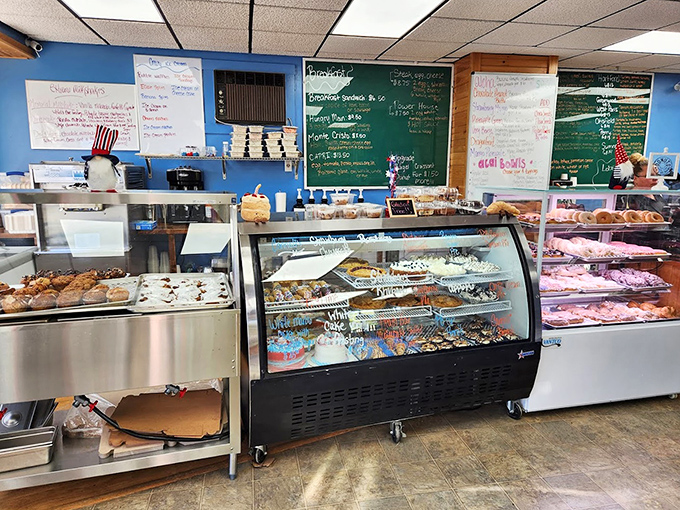 Behind these gleaming display cases lies a treasure trove of homemade delights that would make even the most disciplined dieter weak at the knees.