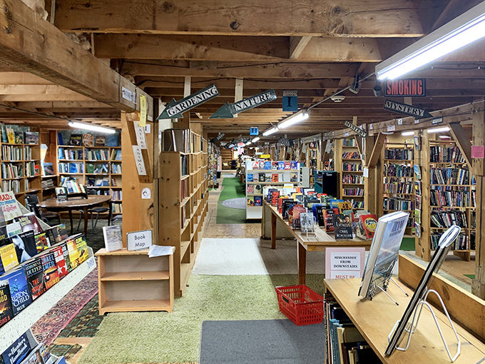 Wooden beams frame endless rows of literary treasures, creating a bibliophile's paradise where time slows and discovery awaits around every corner.