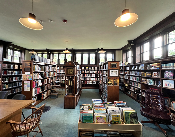 Warm wooden shelves stretch toward the ceiling, creating an intimate reading sanctuary where literary treasures await discovery around every corner.