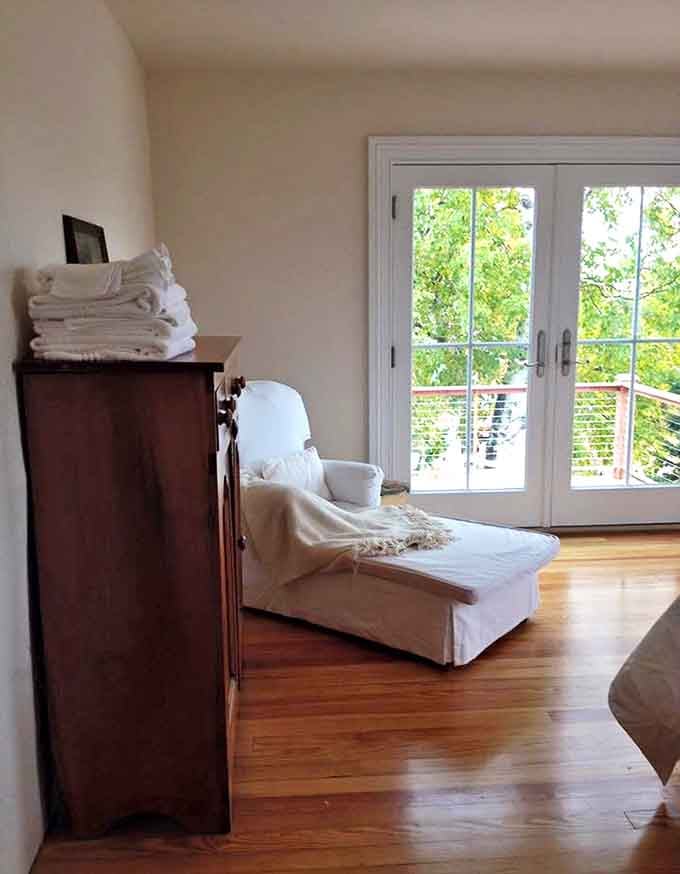 Sunlight streams through large windows, illuminating a cozy reading nook where you can lose yourself in a book or simply watch Lake Superior's ever-changing moods.