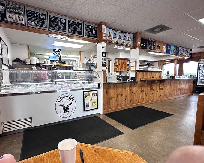 Inside, warm pine paneling and a sprawling menu board create the perfect backdrop for ice cream decision-making &ndash; serious business disguised as sweet pleasure.