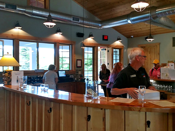 Where rustic meets refined: The tasting room's warm wood tones and industrial lighting create an atmosphere that's simultaneously sophisticated and welcoming.