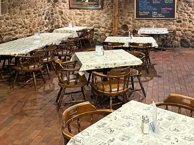 Stone walls and wooden tables create a rustic, intimate atmosphere in The Rock downstairs dining area &ndash; history you can touch while you eat.