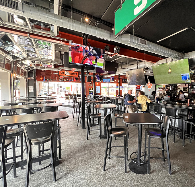 Inside, the industrial-chic interior buzzes with energy as TVs broadcast the game and hungry patrons strategize their nacho attack plans.