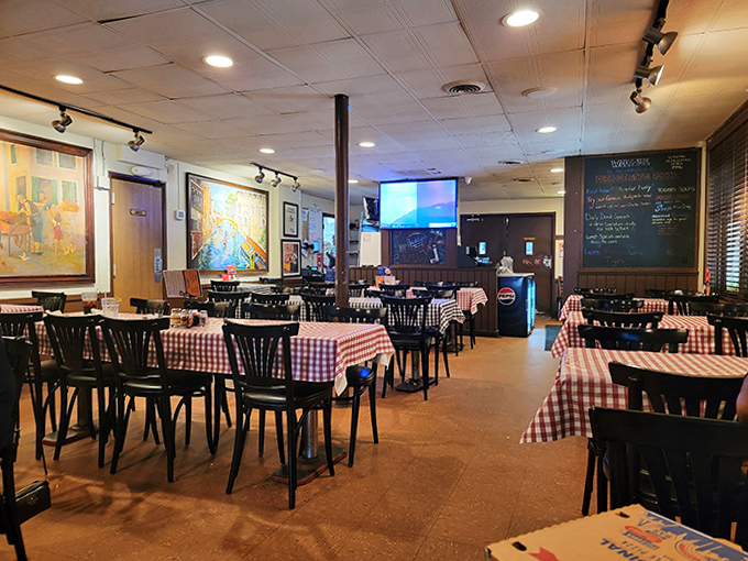Classic red-checkered tablecloths and wooden chairs create that "everybody knows your name" vibe where pizza memories are made and calories don't count.