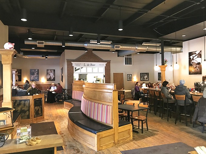 Cozy wooden booths and warm lighting create that "gezellig" atmosphere &ndash; the Dutch concept of coziness that makes you want to linger over coffee.