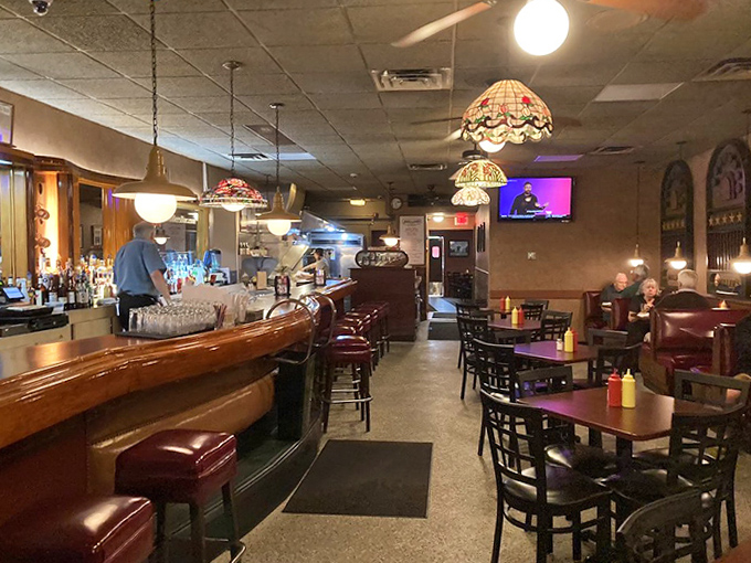 Step inside and time stands still. Curved wooden bar, Tiffany-style lamps, and red vinyl booths create an atmosphere of authentic Americana without trying too hard.