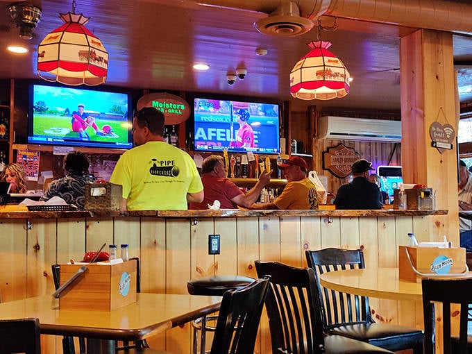 The cozy bar area buzzes with local energy as patrons gather to watch games, share stories, and enjoy hearty pours.