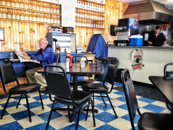 The classic blue and white checkered floor has supported generations of hungry visitors seeking burger perfection in this unassuming spot.