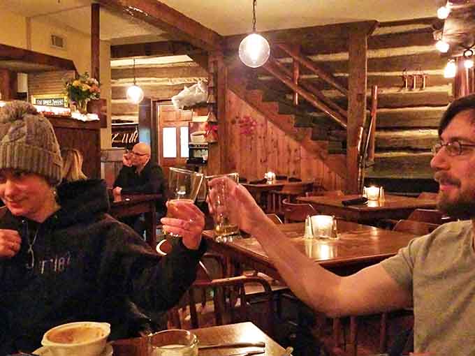 Glasses clink in celebration within the warm embrace of exposed beams and rustic charm that defines the Jail House's inviting interior.