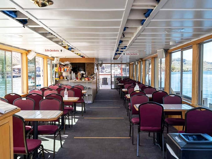 Inside the main cabin, comfortable seating and panoramic windows create the perfect setting for viewing canyon scenery while dining.