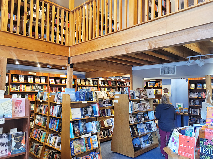 Wooden shelves stretch skyward in this two-story reader's paradise, where books aren't just sold—they're celebrated with reverence.