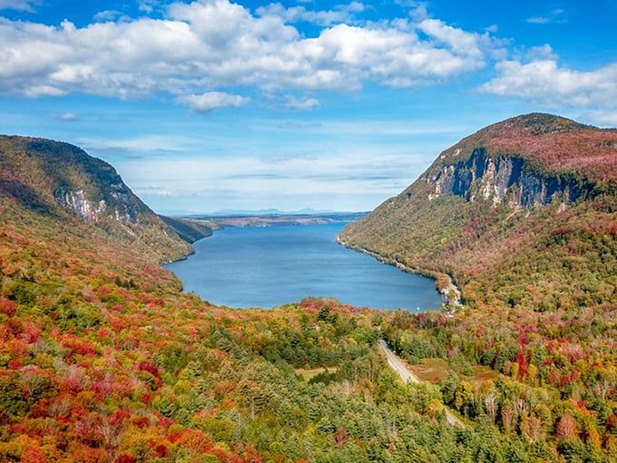 Fall's fiery palette transforms Lake Willoughby into a kaleidoscope of colors reflected perfectly in its crystal-clear depths.