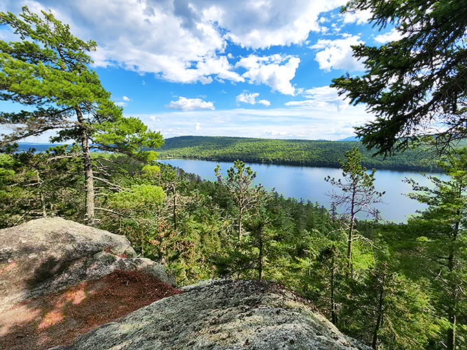 Breathtaking vistas await hikers who venture beyond the caves to overlooks showcasing Maine's pristine wilderness and crystal-clear lakes.