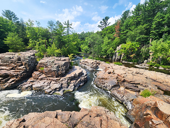 Billion-year-old volcanic rock formations create nature's sculpture garden, where water and time have collaborated on a masterpiece of geological artistry.
