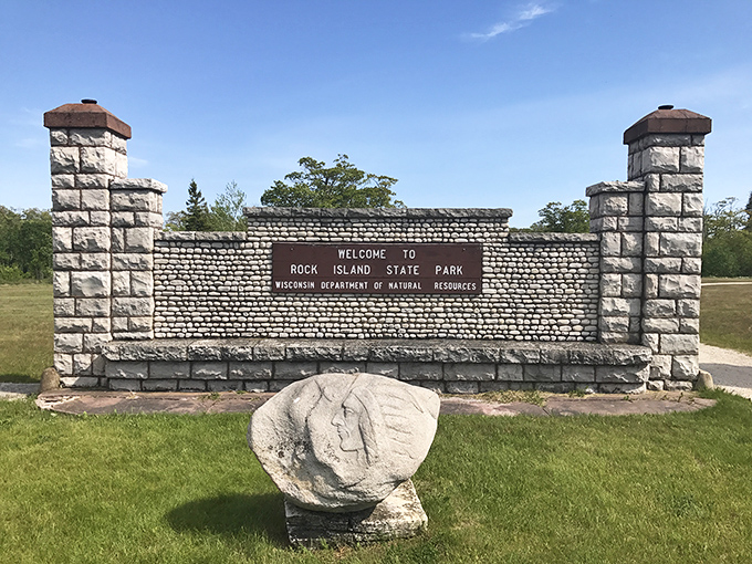 The welcoming committee at Rock Island State Park &ndash; a stone entrance that promises adventures beyond the ordinary Wisconsin experience.