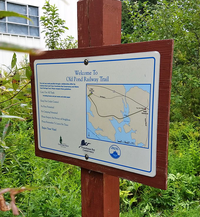 Trail maps don't lie &ndash; this welcoming sign marks the beginning of a journey through time and nature on the Old Pond Railway Trail.