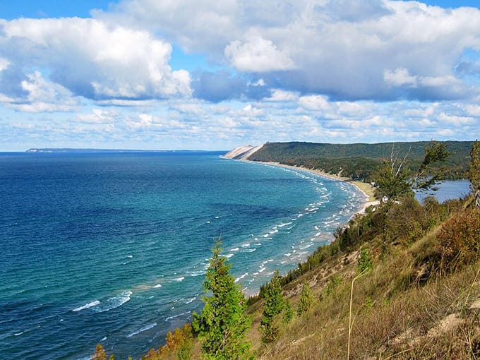 Leelanau Peninsula's coastline stretches like a painting come to life. The curve of the shore against that impossibly blue water makes you forget you're in the Midwest!