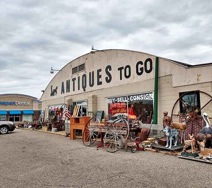 Antiques To Go makes a bold statement with its massive warehouse and eye-catching outdoor displays of wagon wheels and garden art.