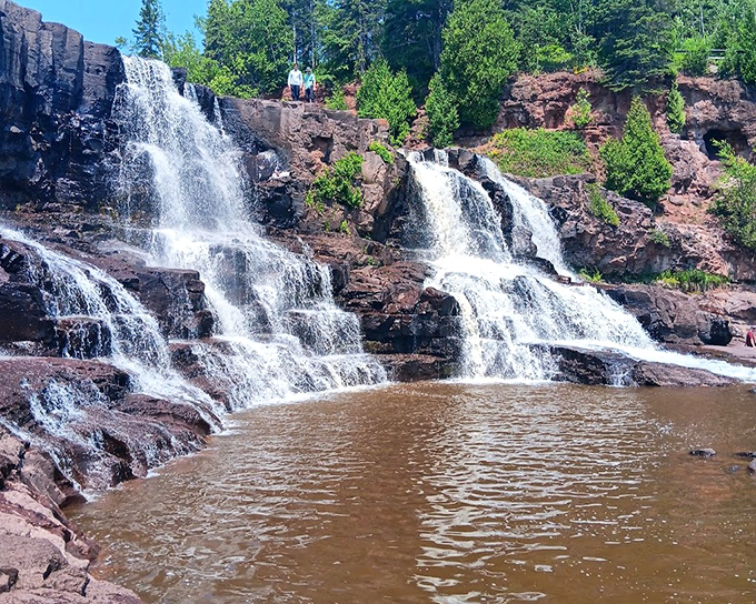 Gooseberry Falls cascades down multiple tiers of billion-year-old volcanic rock, creating nature's perfect photo opportunity just steps from the parking area.