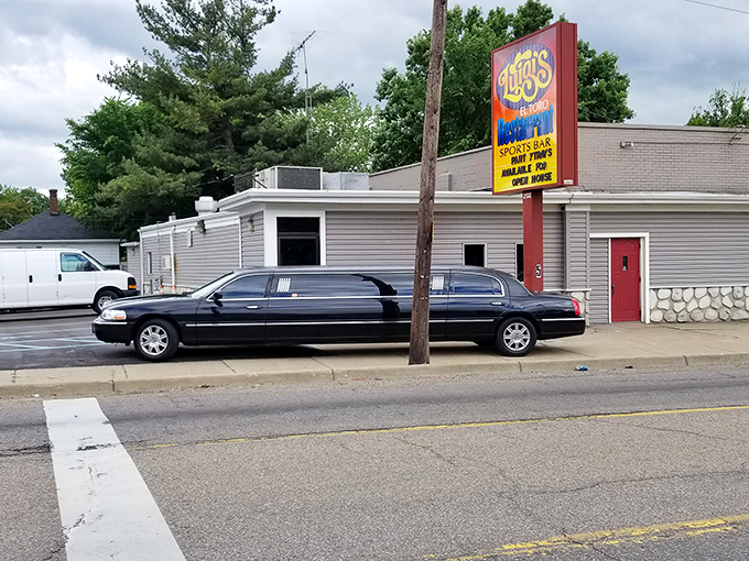Luigi's bright roadside sign beckons pizza pilgrims to this Flint institution, where limousines and family cars alike pull up for legendary pies.
