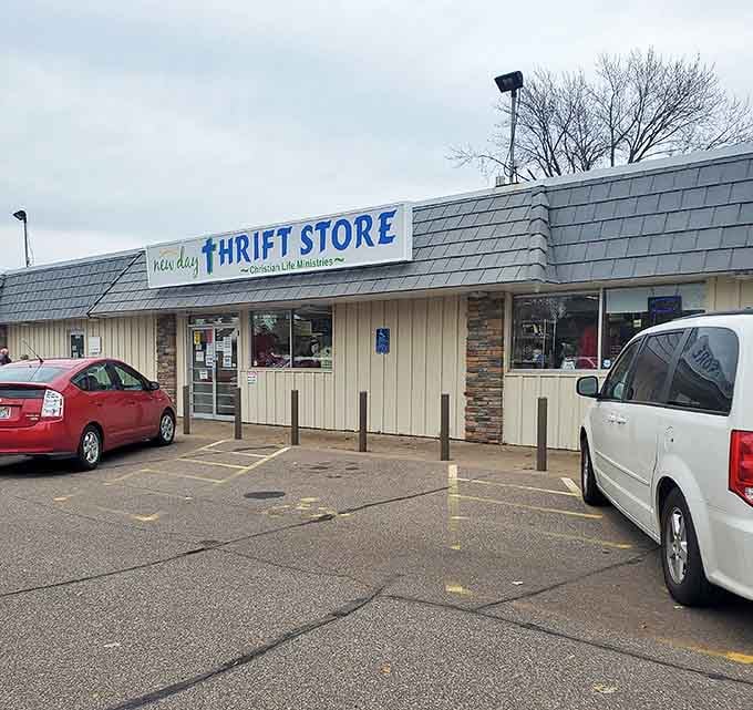 New Day Thrift Store's straightforward exterior houses unexpected treasures within. Don't let the simple facade fool you &ndash; bargains await!