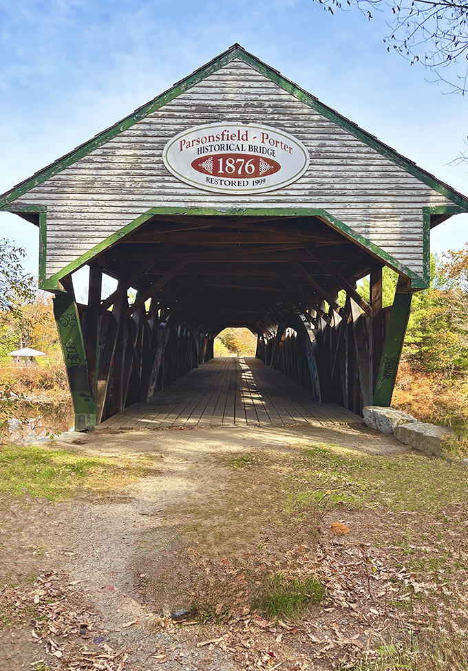 The Parsonsfield-Porter Bridge proudly displays its 1876 heritage with a sign that tells visitors they're stepping into living history.