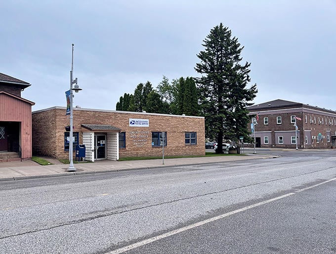 Two Harbors' brick post office building stands as a testament to the town's enduring history, with Highway 61 running quietly past its front door.s