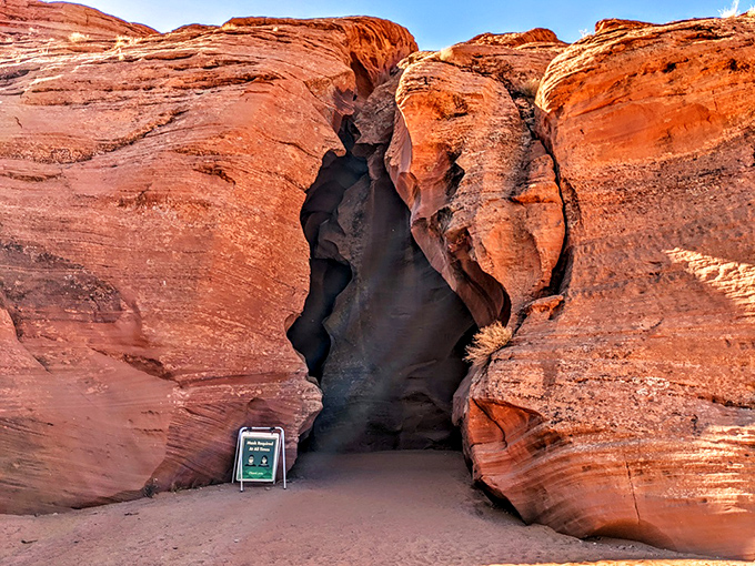 The entrance to Antelope Canyon beckons adventurers into a magical underground world where light and shadow play like old friends.