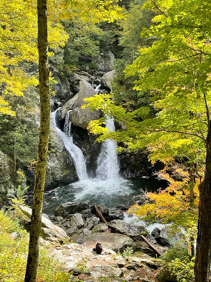 Fall foliage frames Bash Bish Falls in a golden glow. The combination of tumbling water and autumn colors creates a scene straight from a painter's dream.