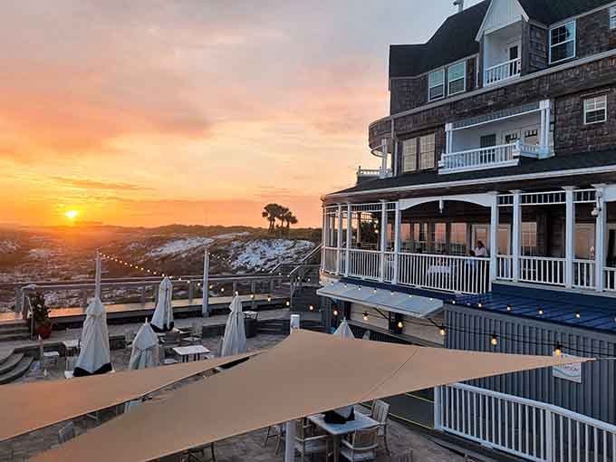 That golden hour glow hits different when you're dining on a porch overlooking the Gulf of Mexico.