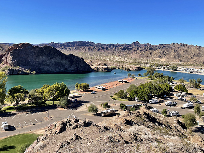 The golden shores of Buckskin Mountain State Park offer perfect swimming spots with picnic areas just steps from the Colorado River's edge.