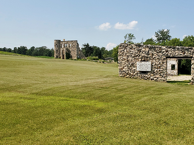 Historic stone structures stand sentinel at Maribel Caves, remnants of the park's fascinating past amid natural splendor.