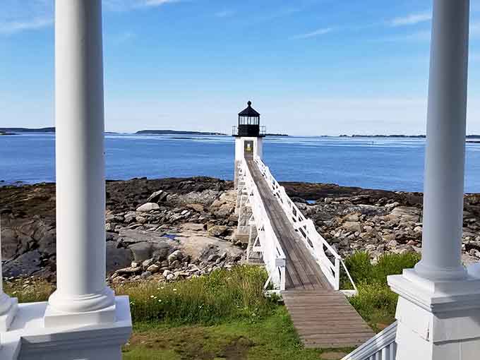Low tide reveals the rocky shoreline where countless visitors have recreated that famous Forrest Gump moment.
