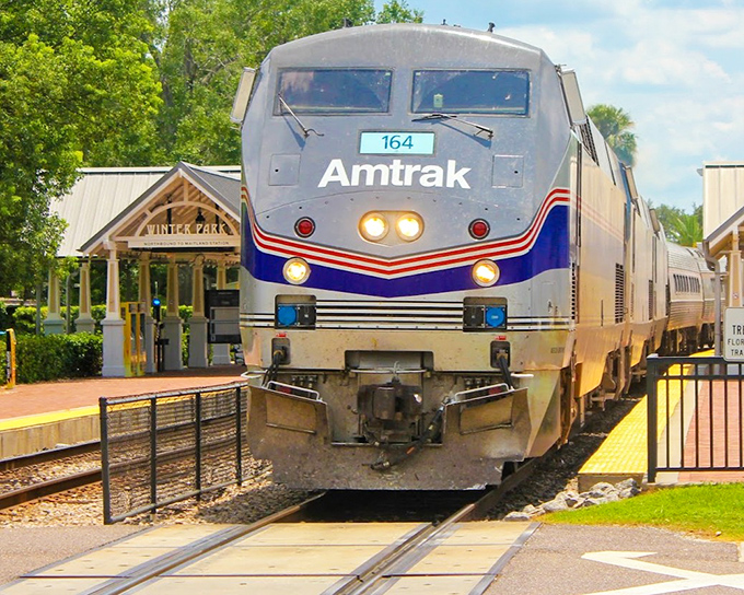 Amtrak train #164 arrives at a quaint Florida station, where the covered platform offers a shady welcome to travelers embarking on their small-town adventure.