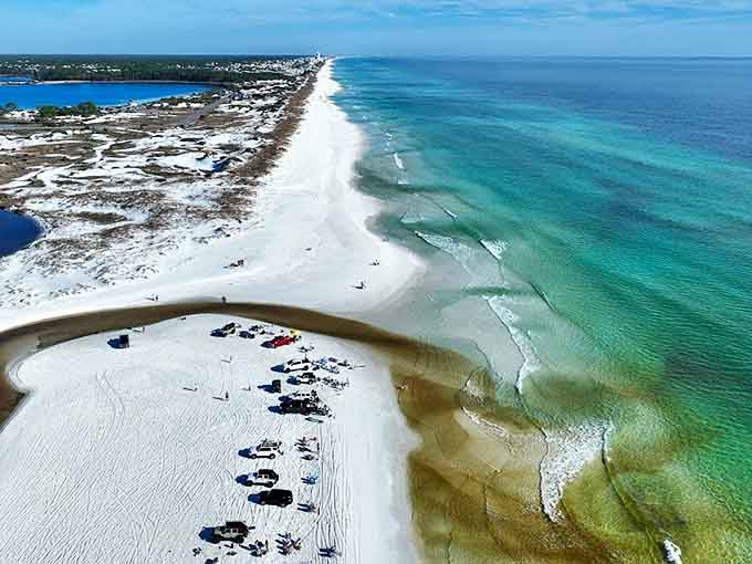 Bird's eye perfection! The coastal dune lake meeting the Gulf creates a watercolor masterpiece only Mother Nature could paint.