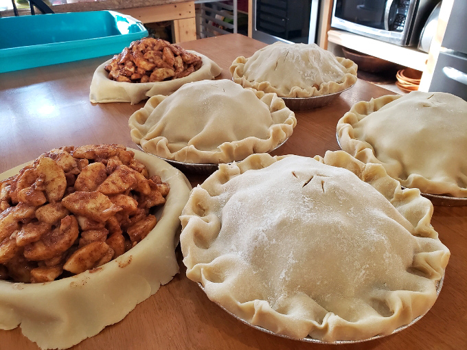 These aren't just apple pies, they're edible works of art with perfectly crimped edges waiting to reveal their cinnamon-spiced treasures.