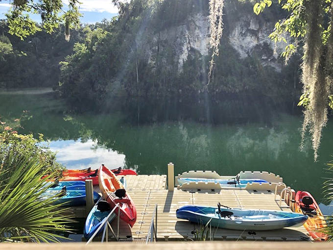 Colorful kayaks await their next explorers at the peaceful dock, promising up-close encounters with the crystal-clear canyon waters.