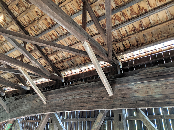 Look up to marvel at the intricate Paddleford truss system, hand-assembled by craftsmen whose legacy continues to support travelers today.